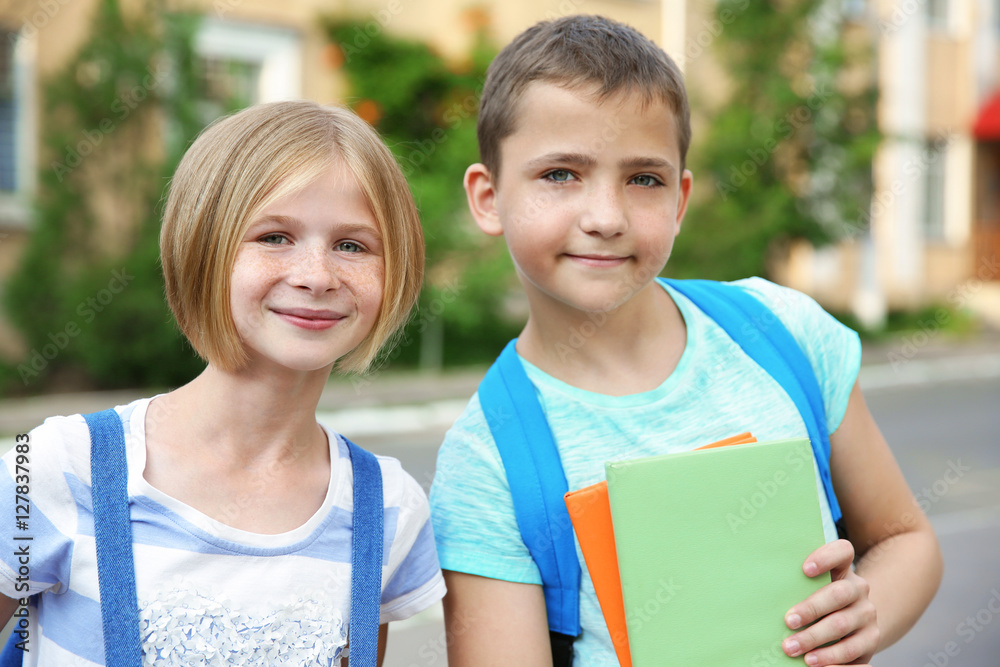 Cute schoolkids on street Stock-Foto | Adobe Stock