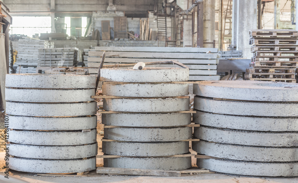 Stack of precast reinforced concrete slabs in a house-building factory ...