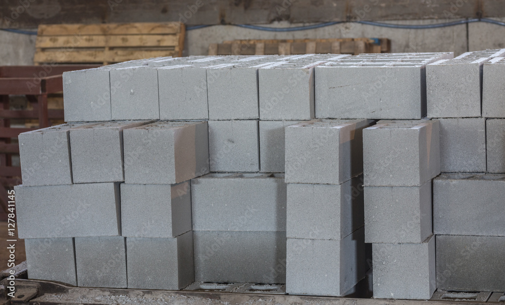 Stack of precast reinforced concrete slabs in a house-building factory ...