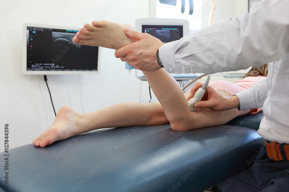 Ultrasound of girl's knee-joint - diagnosis Stock Photo | Adobe Stock