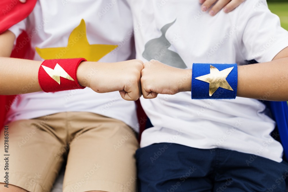 Superheroes Friends Fist Bump Happiness Concept Stock Photo | Adobe Stock
