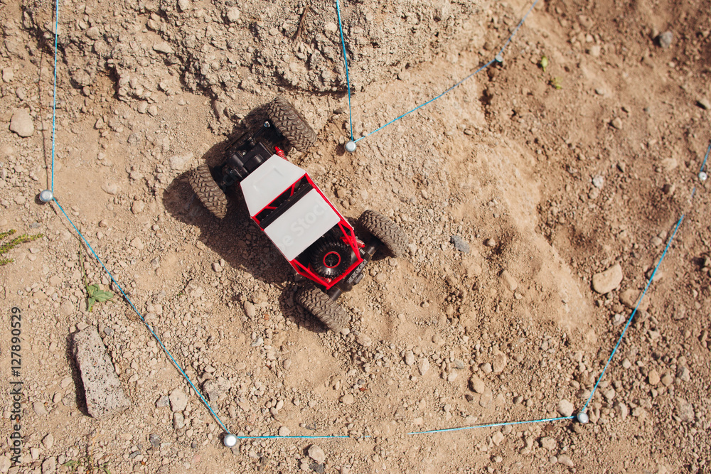 Rc suv riding offroad rally, top view, free space. Toy crawler driving ...