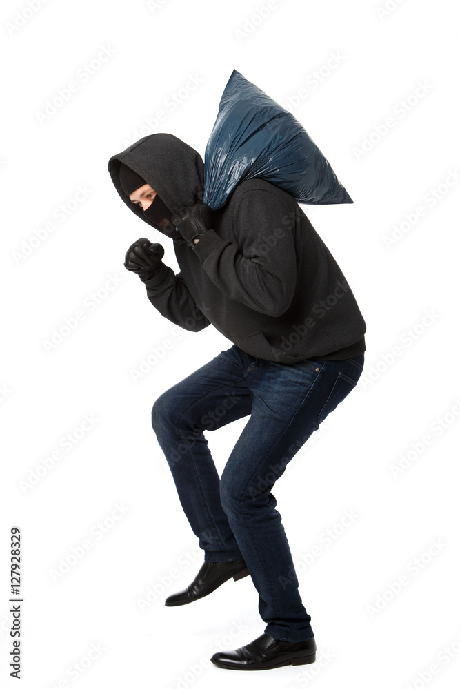 Robber steals with large bag Stock Photo | Adobe Stock