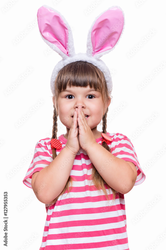 Happy little girl with pink rabbit ears. Portrait of cute caucasian ...