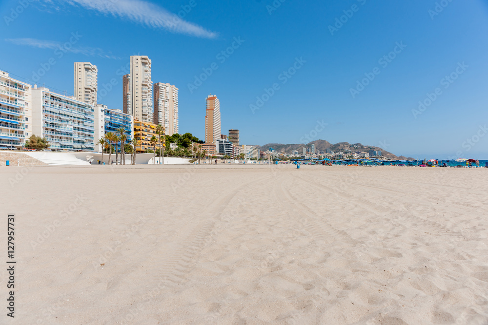 Benidorm beach Spain with apartment buildings and esplanade backdrop to ...