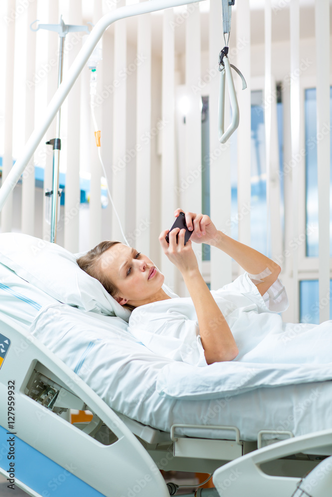 Pretty, young, female patient in a modern hospital room Stock Photo ...