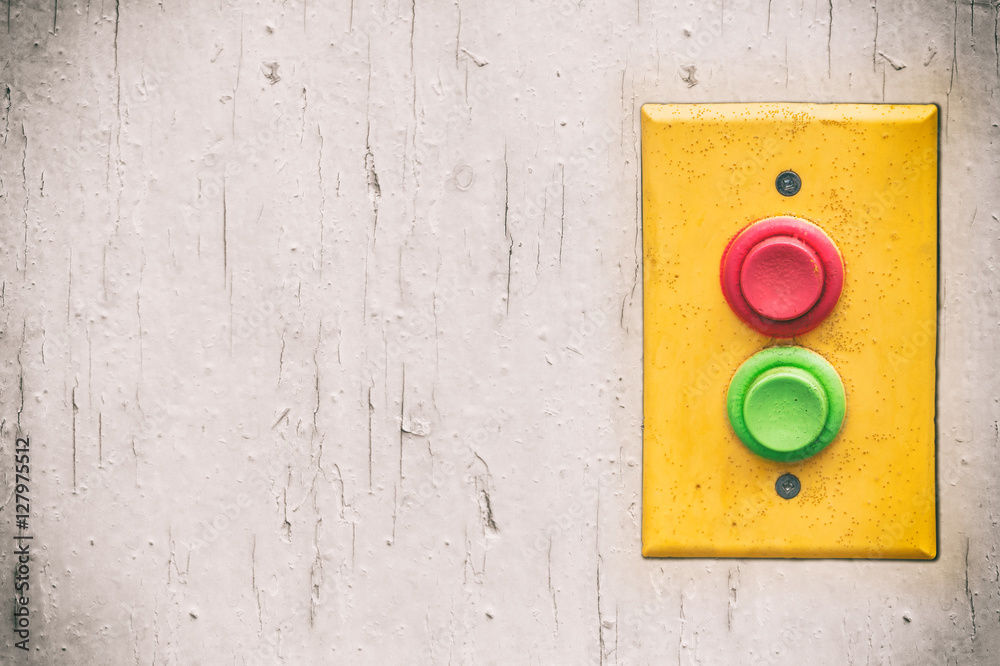 Yellow panel with rempty red and green buttons over bright background ...