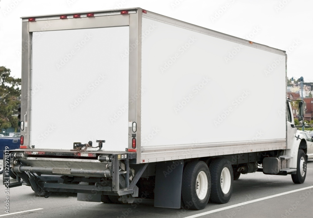 Rear and side view of parked delivery truck. Horizontal. Stock Photo ...