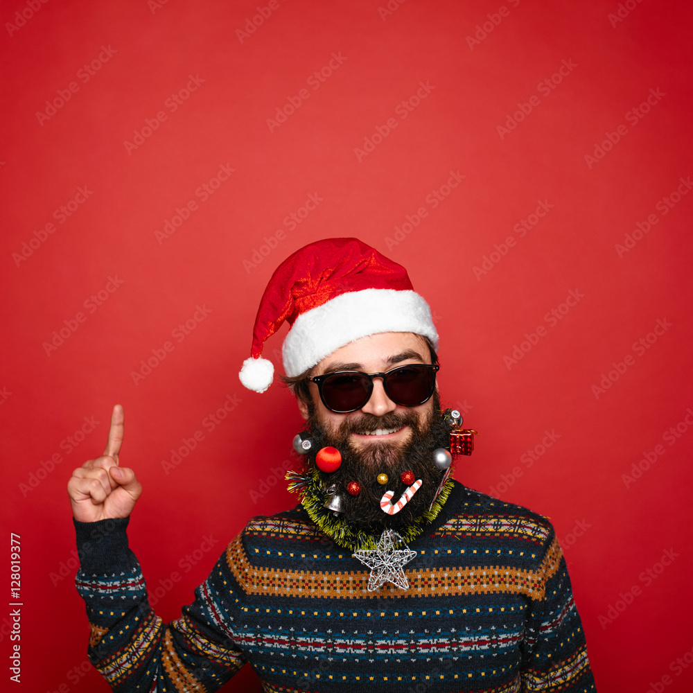 handsome new year man with decorated beard pointing up Stock Photo ...