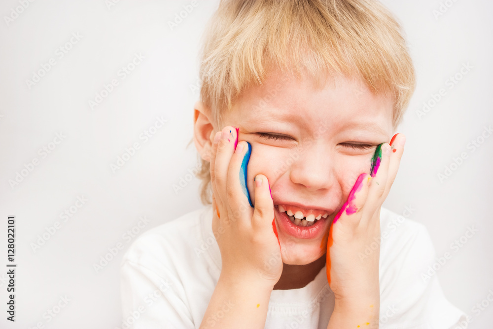 Little child laughing after painting with fingers. Funny baby touching ...