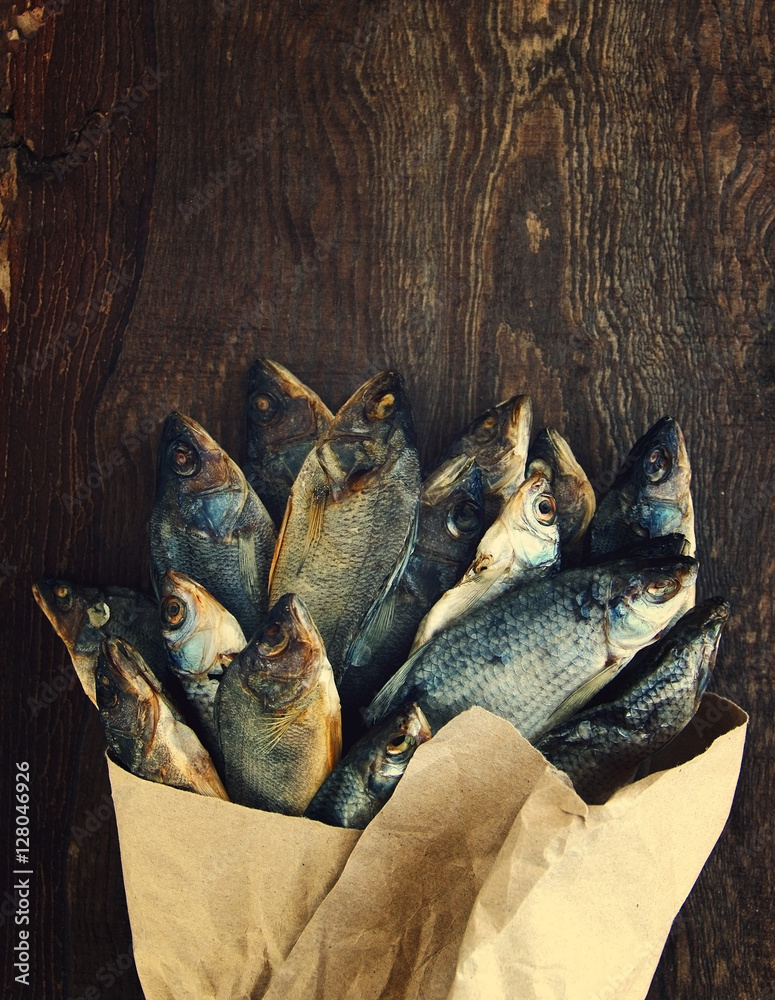 Bouquet from salty dry fish. Salty dry fish in a paper paper bag. Gift ...