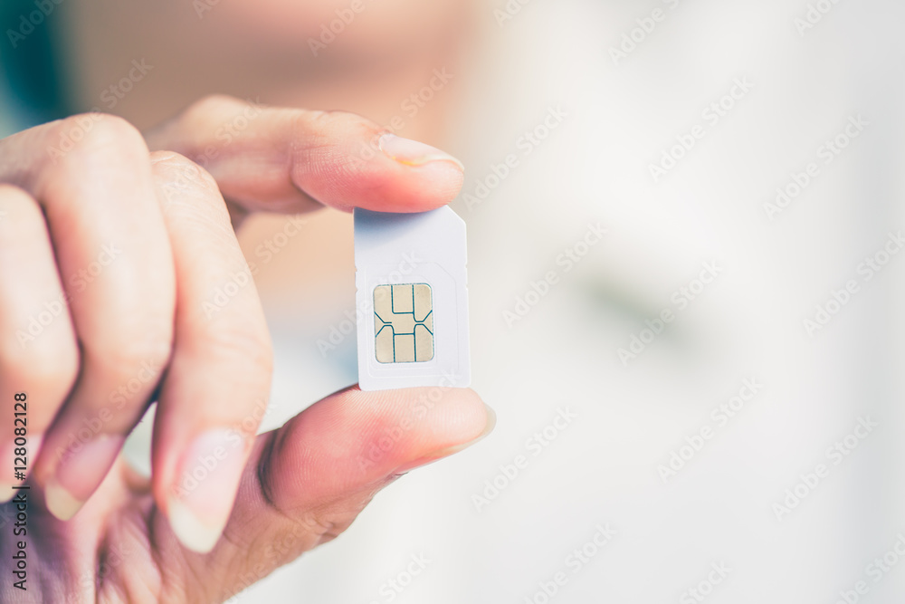 Hand holding sim card, select focus, color effect Stock Photo | Adobe Stock
