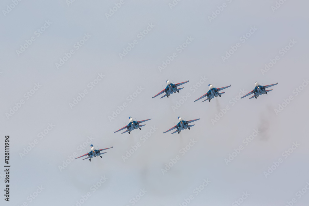 Fighter Sukhoi Su-27 show aerobatics at an airshow Russian Knights ...