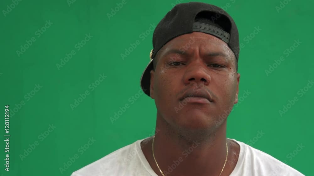 Cuban people and emotions, portrait of serious hispanic man looking at ...