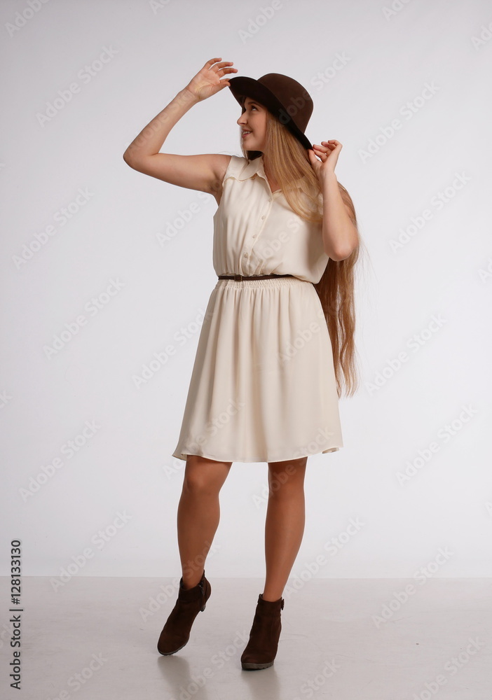 Beautiful woman posing in studio on light background. Stock-Foto ...