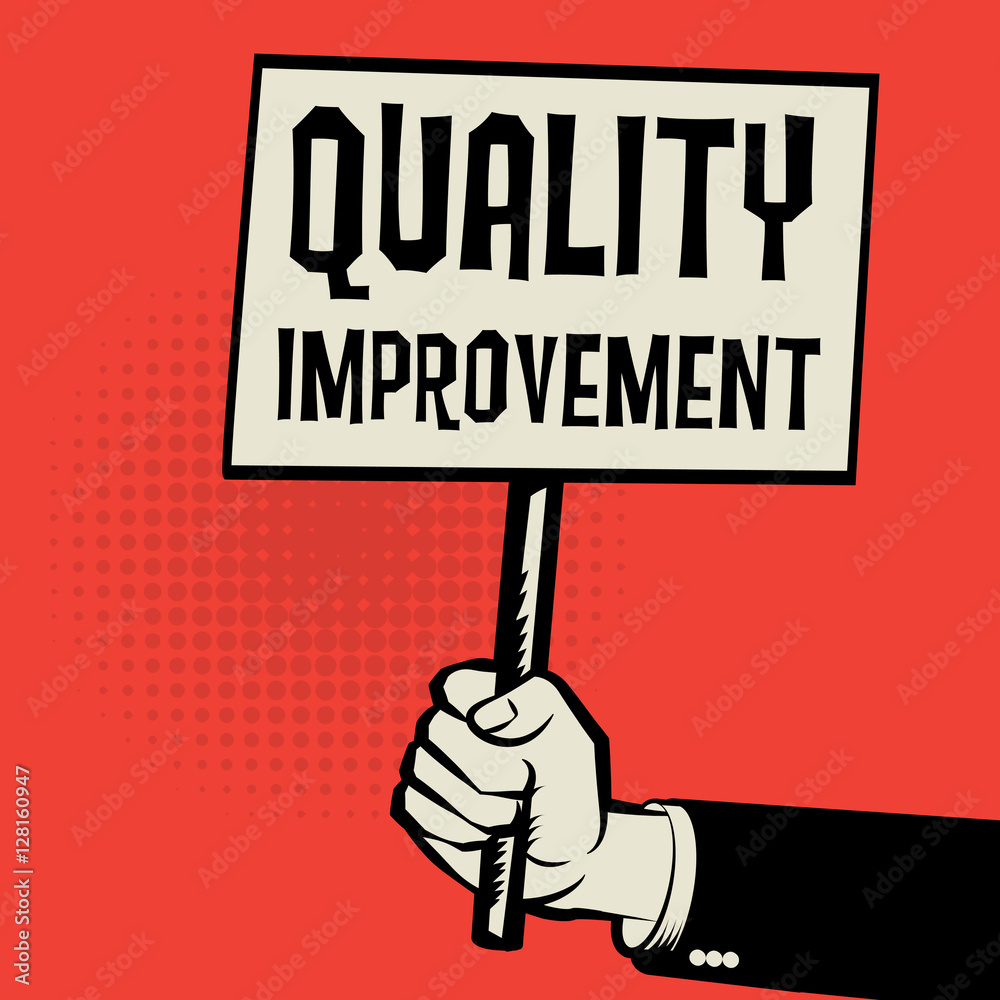 Poster in hand, business concept with text Quality Improvement Stock ...