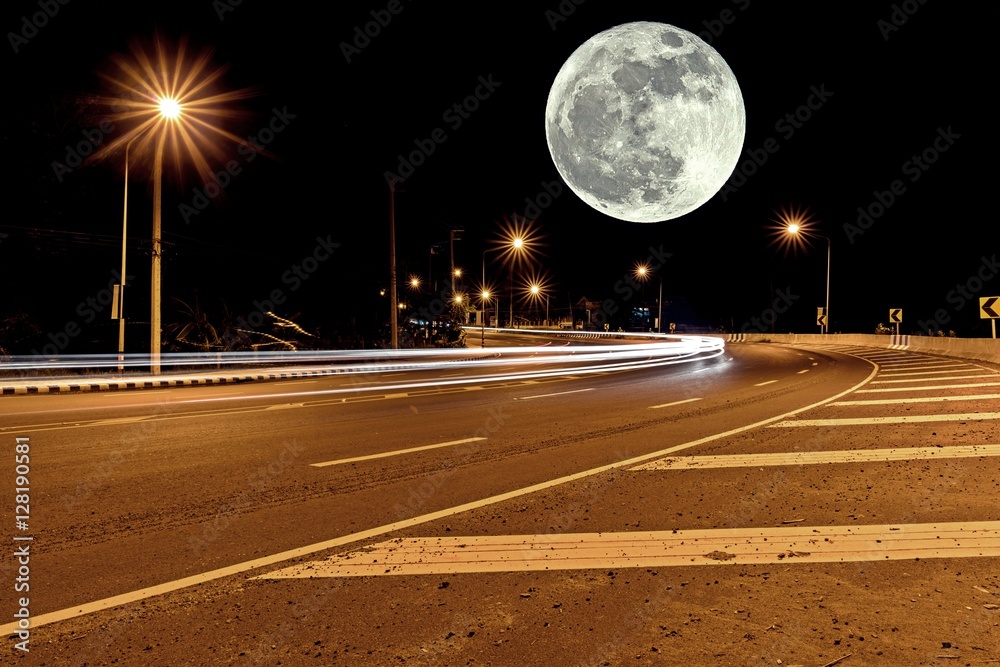 Car White Light trail sparkly on Long macadamized curvy road with ...
