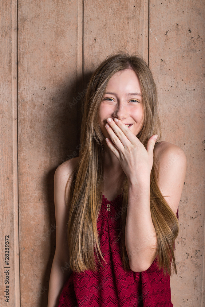 Beautiful giggling teen girl in Red top Stock Photo | Adobe Stock