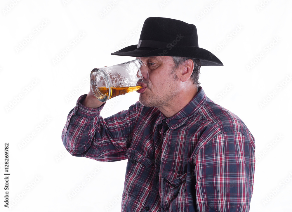 a man in a cowboy hat drinking beer Stock Photo | Adobe Stock