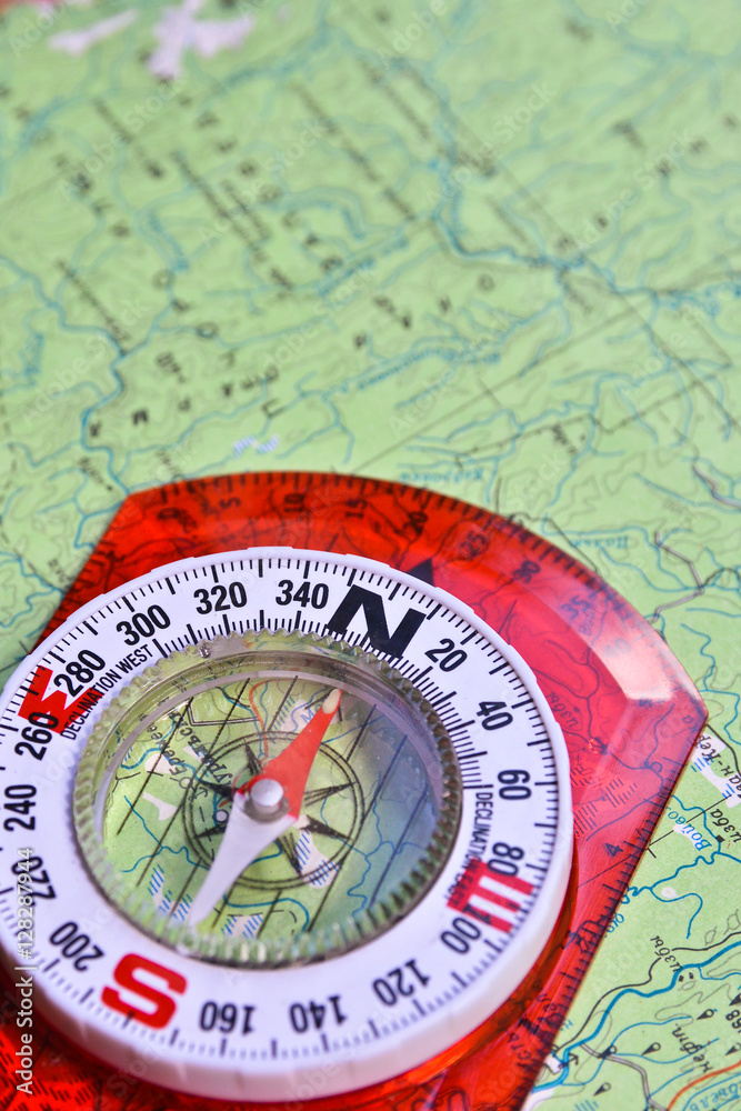 Symbols of travel - map with compass. Stock Photo | Adobe Stock