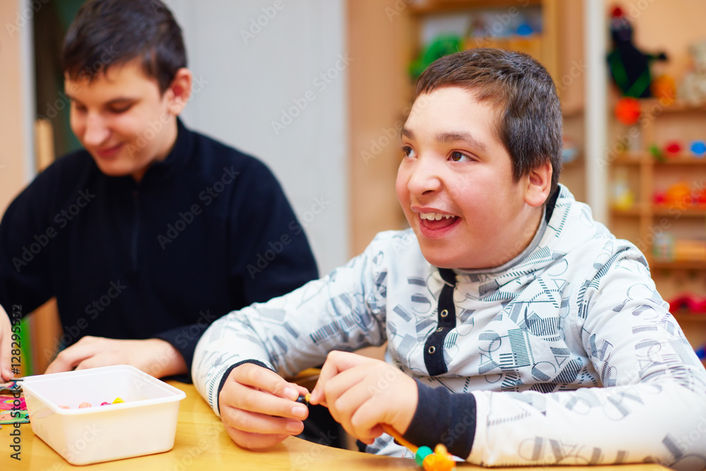 happy kids with disability develop their fine motor skills at ...