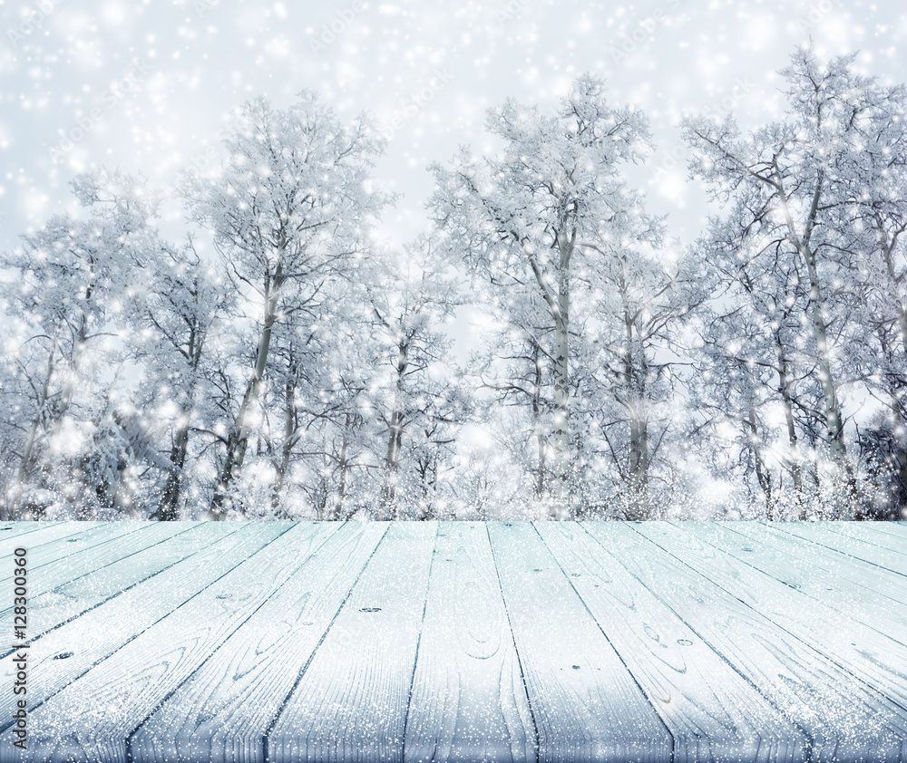 Wood table top on winter trees with snow effect background Stock Photo ...