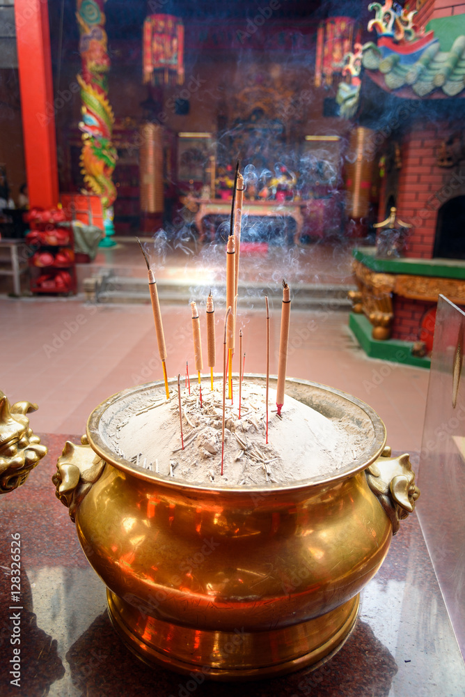 Incense sticks in the pot inside Chinese temple Stock Photo | Adobe Stock