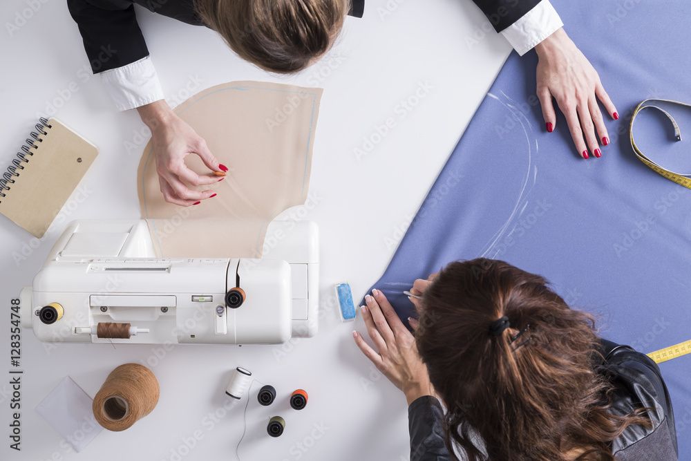 Top view of two girls making a pattern in collaboration Stock Photo ...