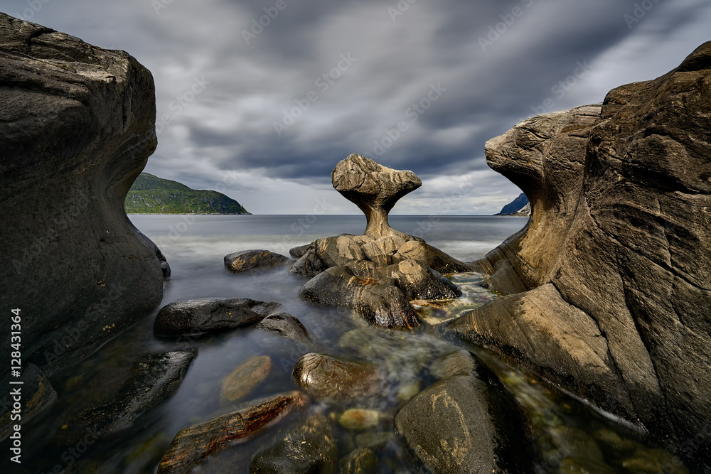 norway, Unusual stone in Atlantic ocean coast. View on Kannesteinen and ...