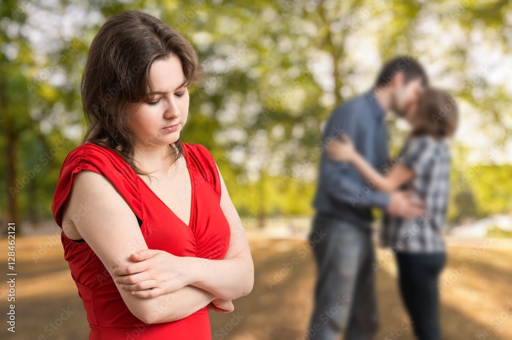 Young Sad Jealousy Woman Is Seeing Boyfriend Kissing And Flirting With