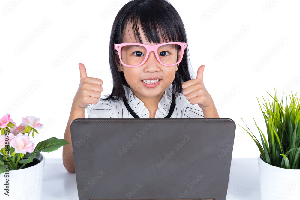 Smiling Asian Chinese little girl using laptop with thumbs up Stock ...