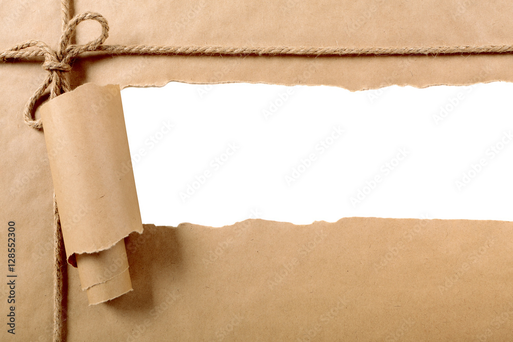 Torn paper parcel strip brown package parcel background tied with ...