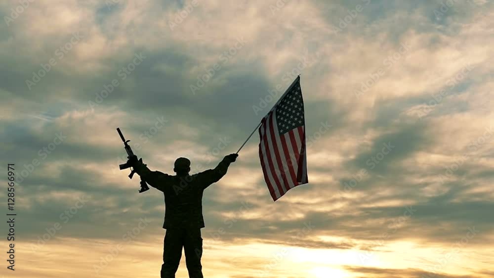 Soldier lift up American Flag and automatic rifle .Slow Motion. Stock ...