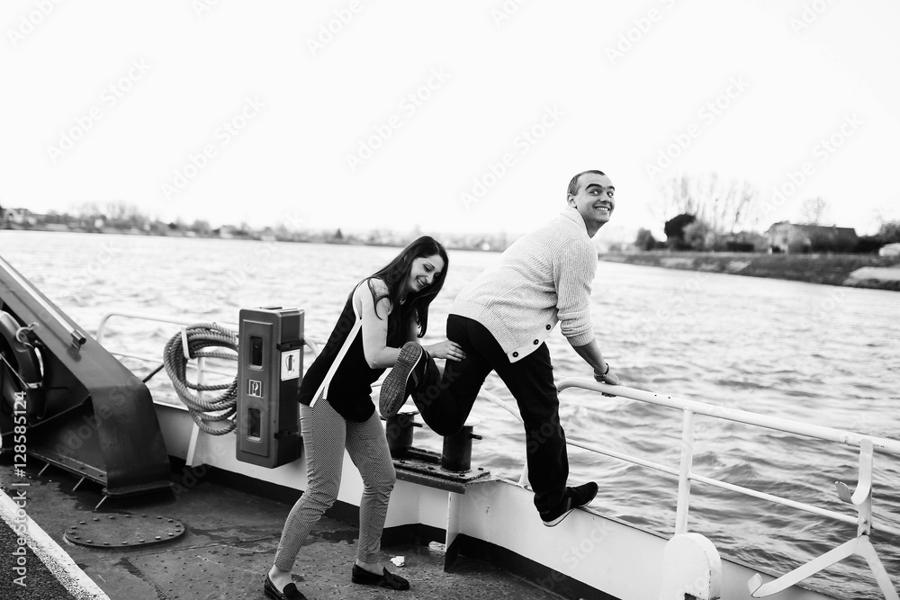 happy and young couple are floating on a yacht Stock Photo | Adobe Stock