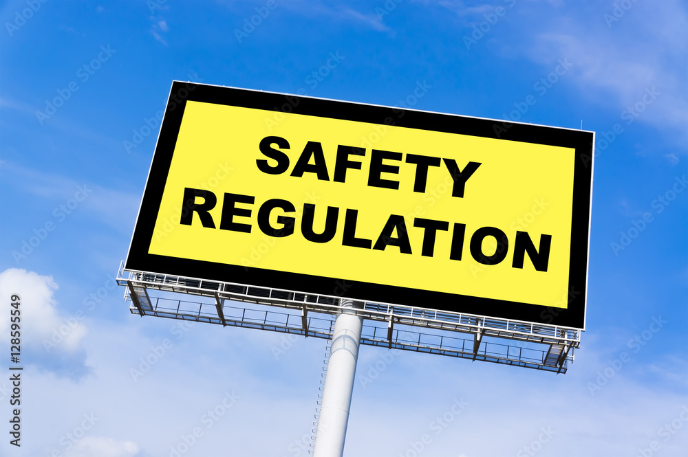 Foto de Safety regulation sign billboard and clouds blue sky background ...