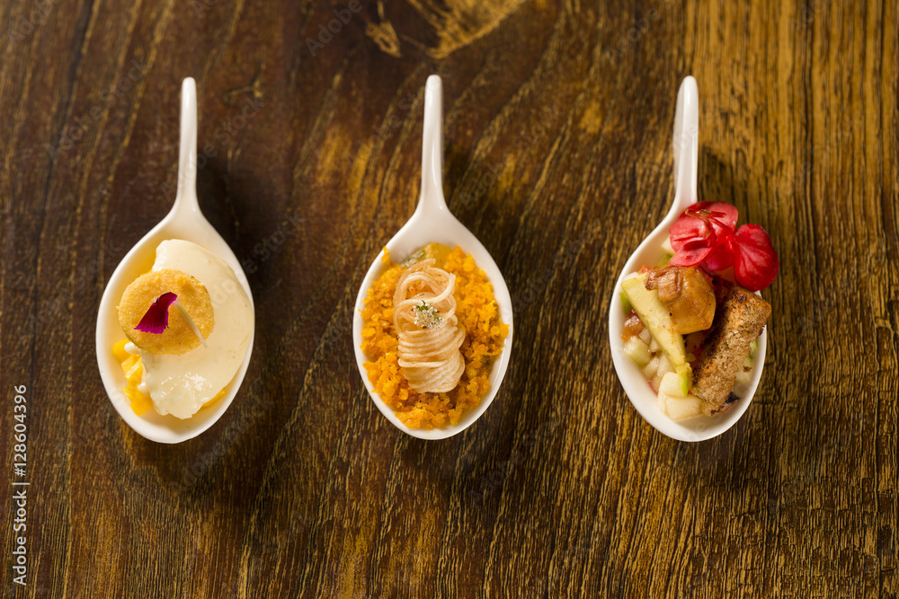 Poster Entry, entree and dessert of finger food in a spoon – Wall Art ...