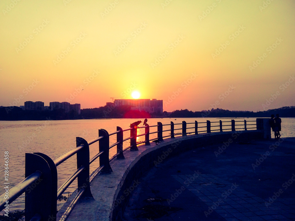 Powai lake sunset in mumbai Stock Photo | Adobe Stock