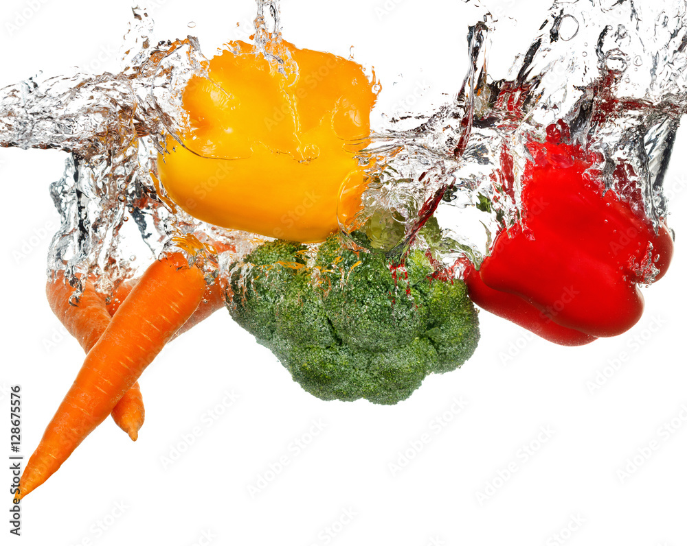 Vegetables in water splash. Isolated on white background Stock Photo ...