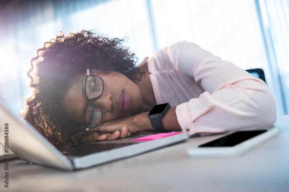 Businesswoman sleeping on her desk Stock Photo | Adobe Stock