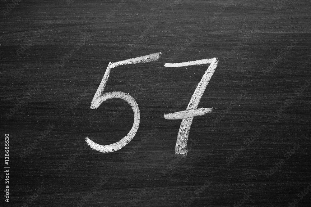 number fifty seven enumeration written with a chalk on the blackboard ...