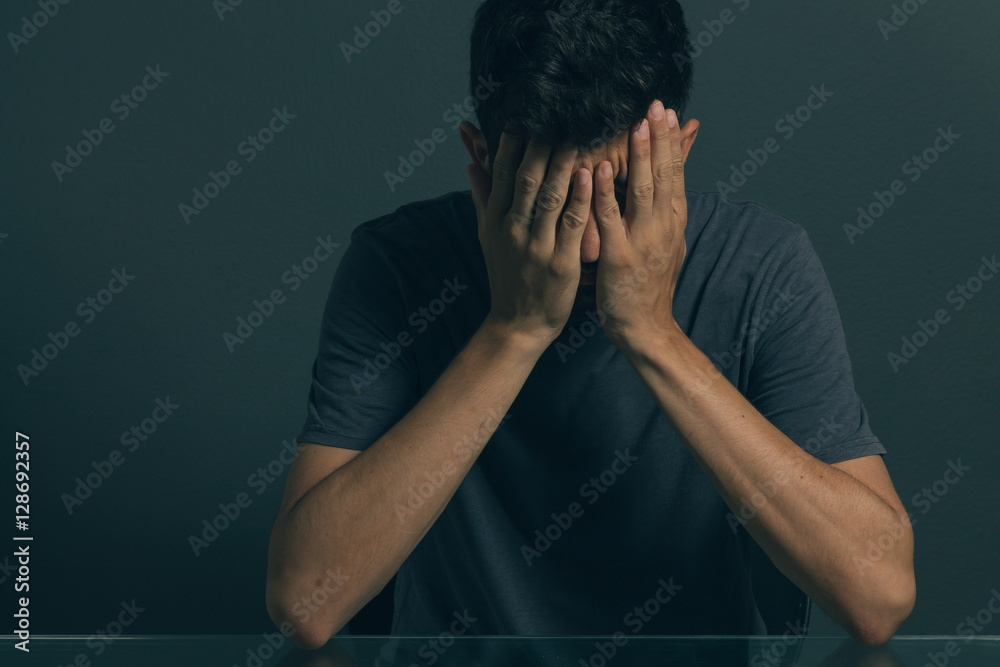 Sad man sitting in dark room. Depression and anxiety disorder concept ...