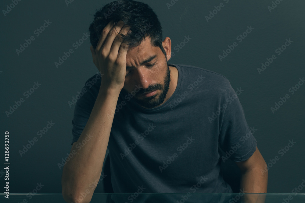 Sad man sitting in dark room. Depression and anxiety disorder concept ...