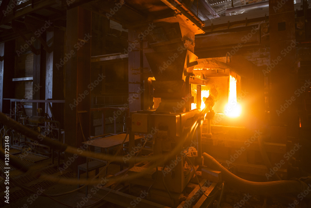 large melting furnace.Glass recycling. Bottle manufacturing industrial ...