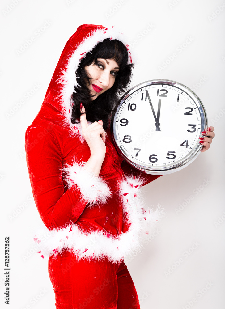 young beautiful woman in red coat holding big clock. time concept ...