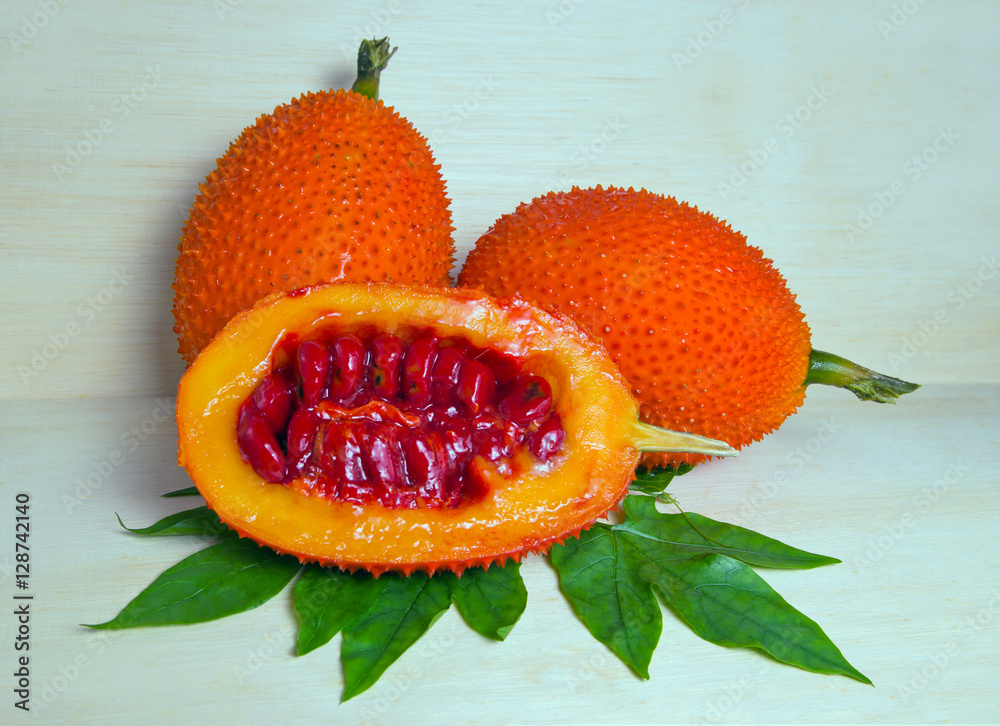 Gac fruit, typical of orange-colored plant foods in Asia with ha Stock ...