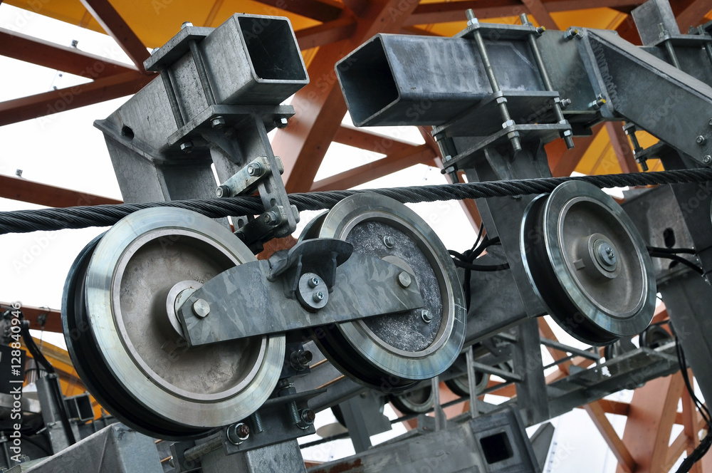 Details of the driving mechanism of cable car. Metal wheels and frame ...