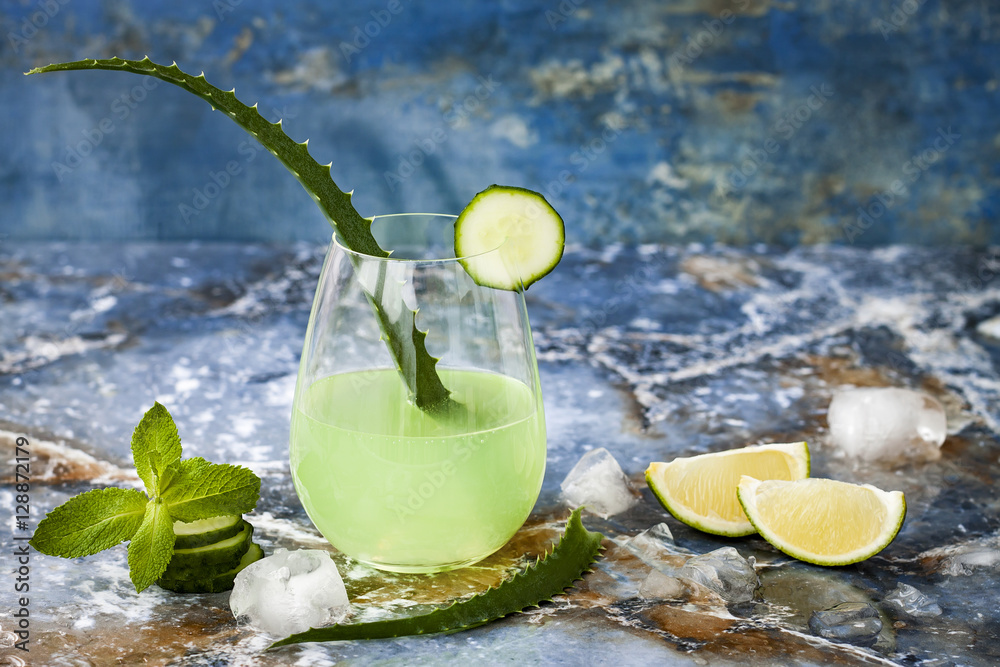 Sparkling cucumber mint gin and tonic fizz with aloe vera on marble ...