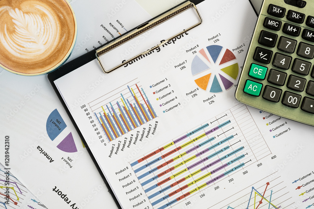 office desk working table with calculator, business graph or analysis ...