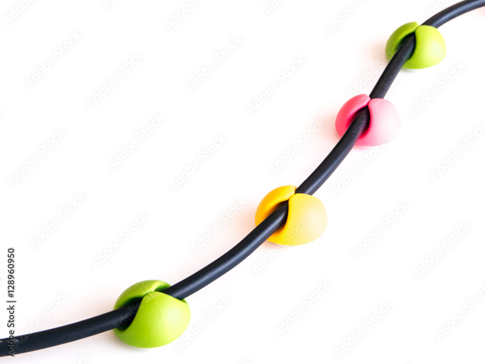 Colorful wall stick wire clip Stock Photo | Adobe Stock