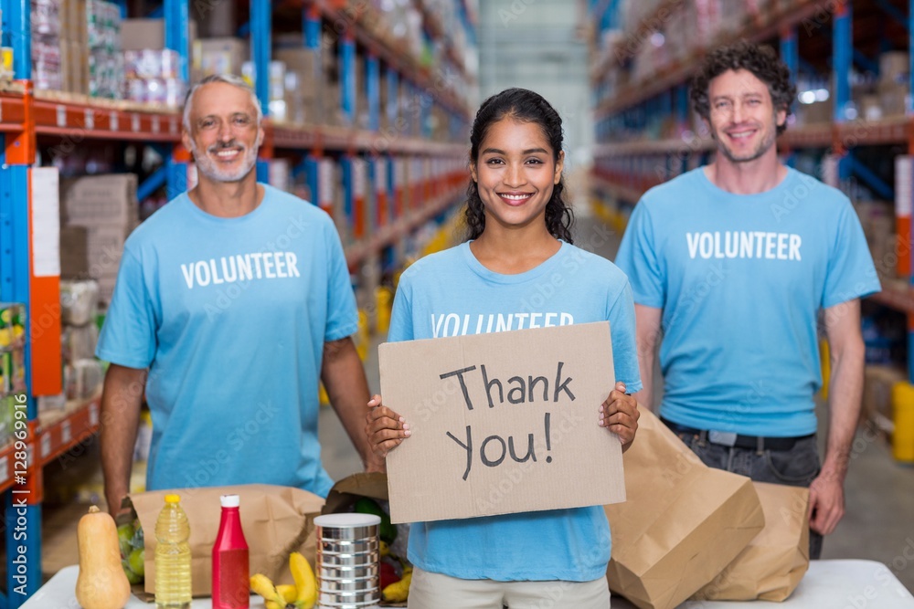 Happy colleagues holding sign boards with thank you message Stock Photo ...